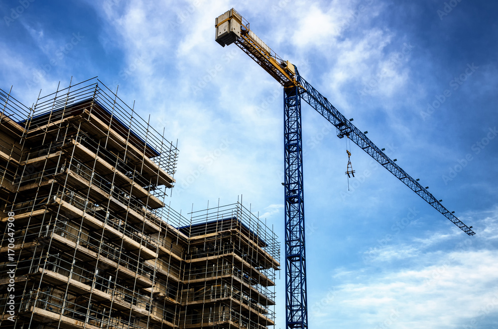 Building construction work yard with clouds and crane Stock Photo ...