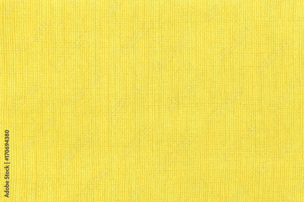 Yellow background from a textile material with pattern, closeup ...