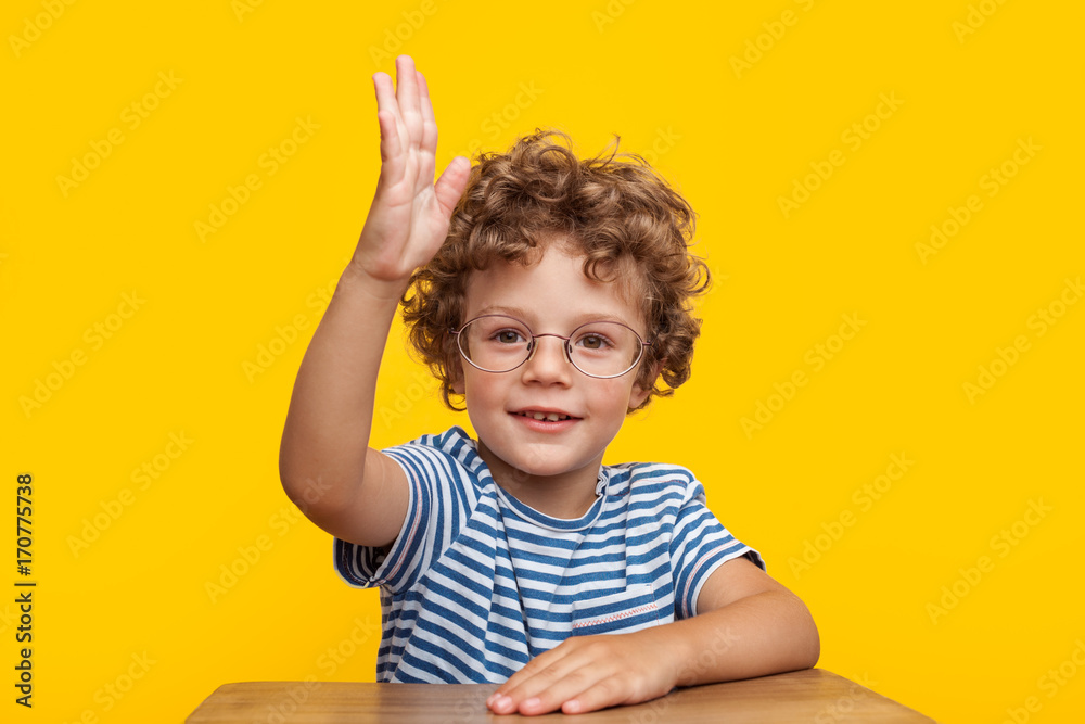 Young boy holding hand up Stock Photo | Adobe Stock