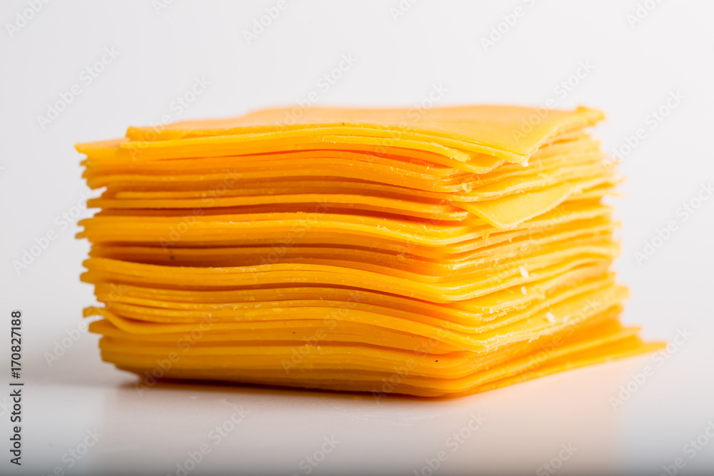 Cheddar cheese slices close up Stock Photo | Adobe Stock
