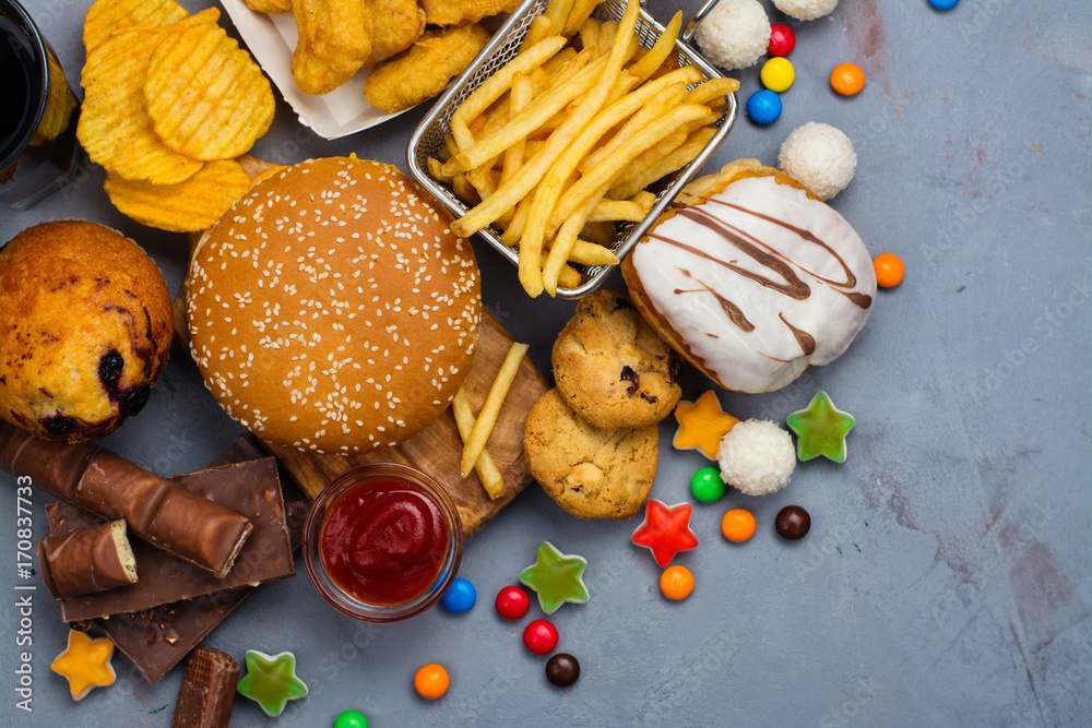 Assortment of unhealthy products that's bad for figure, skin, heart and ...