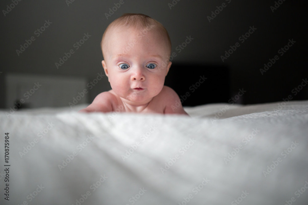 Baby boy with surprised facial expressions Stock Photo | Adobe Stock