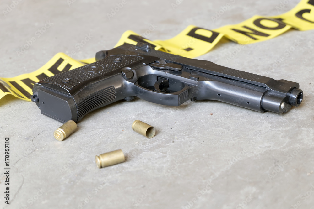 Crime scene concept with gun and three casings Stock Photo | Adobe Stock Crime scene concept with gun and three casings Stock Photo | Adobe Stock