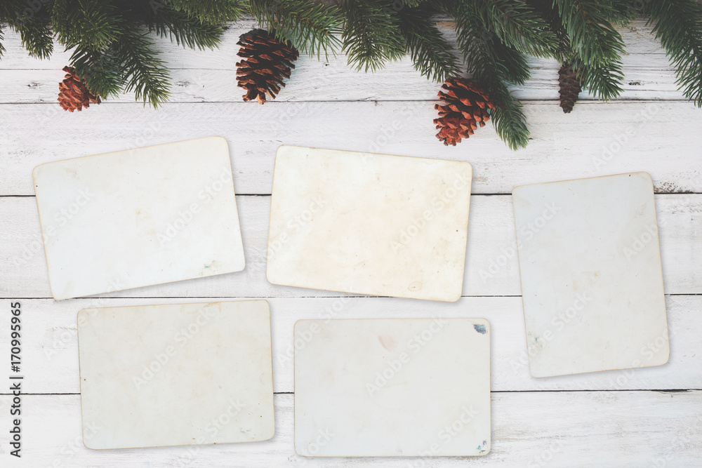 Blank photo frame album - empty old instant photos paper on wood table ...