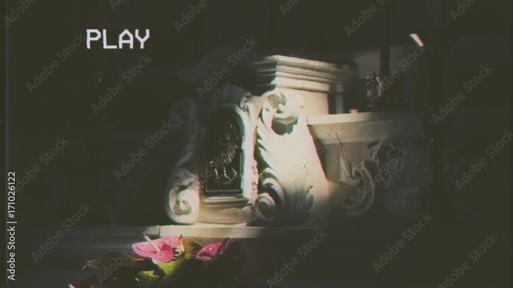 Fake VHS tape: the stone altar of a dark church, lightened up by an ...