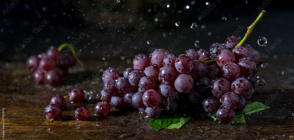panoramic of grape has water splash with dark background. feeling fresh ...