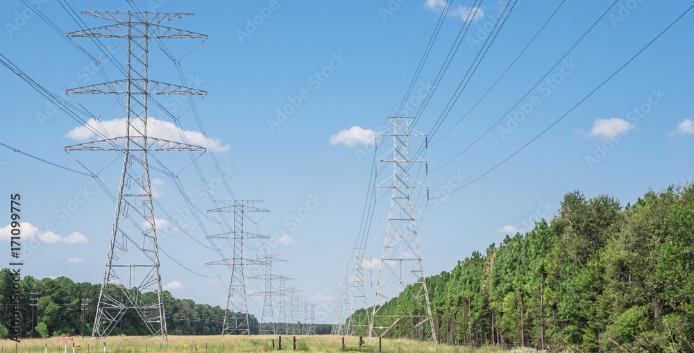 Parallel rows of transmission towers (power tower, electricity pylon ...