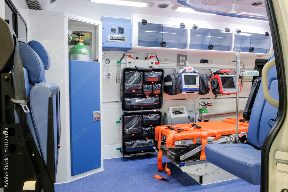 Inside an ambulance with medical equipment for helping patients before ...