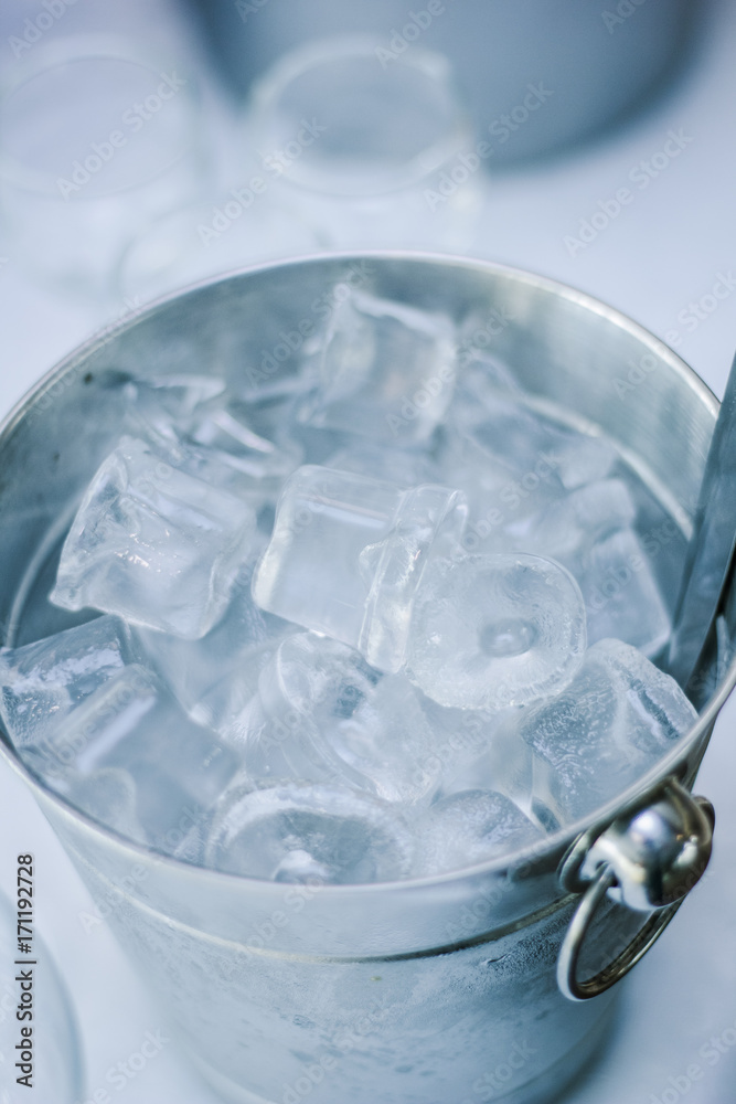 Cold ice in a bucket. Ice Bucket with tranparent cubes of ice Stock ...
