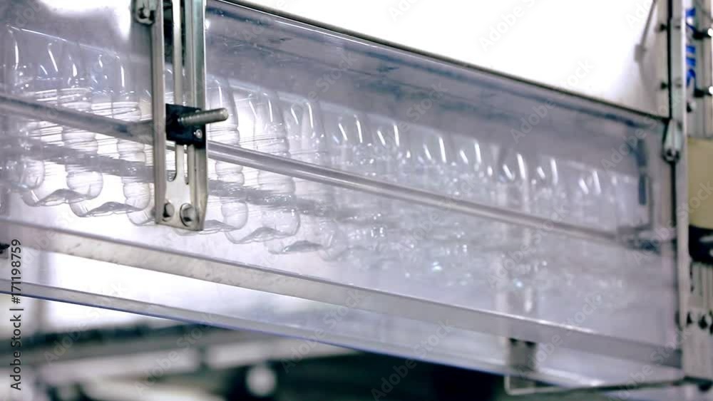 Empty plastic bottle on conveyor line. Bottle production line. Plastic ...