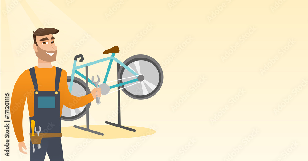 Caucasian bicycle mechanic showing spanner on the background of broken ...