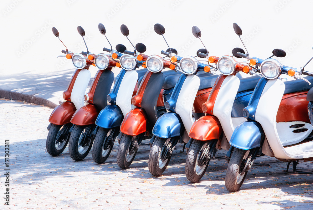 Colorful moped scooter parking. Transport wheel. Summer sunlight flare ...