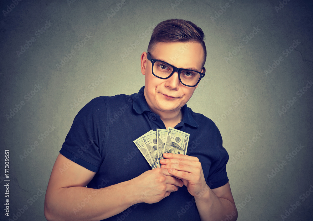 Serious suspicious greedy man with money Stock Photo | Adobe Stock