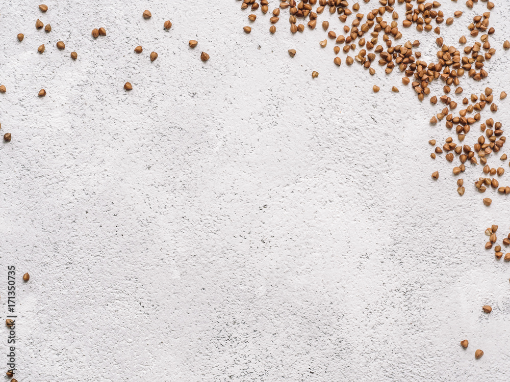 Flax seeds with copy space. Brown flax seed on gray concrete textured background. Top view or ...