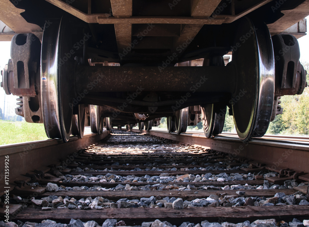 Underside of a train on railroad tracks Stock Photo | Adobe Stock