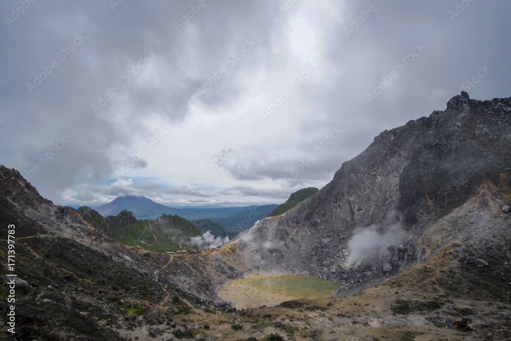 Caldera of Sibayak Volcano and Sinabug Volcano in the far background ...