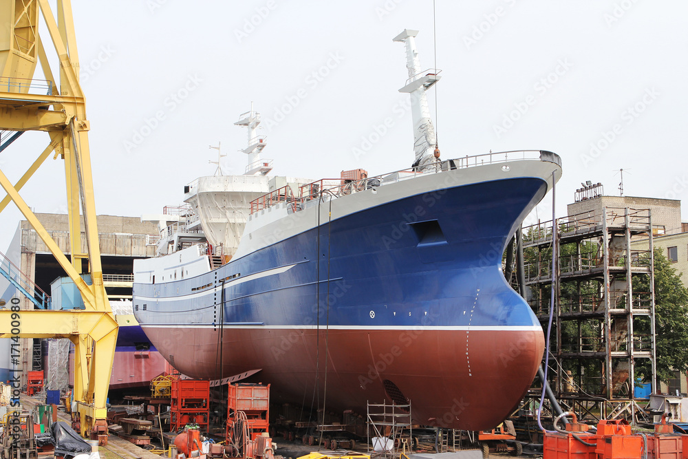 Big ship on dry dock in shipyard. Stock Photo | Adobe Stock