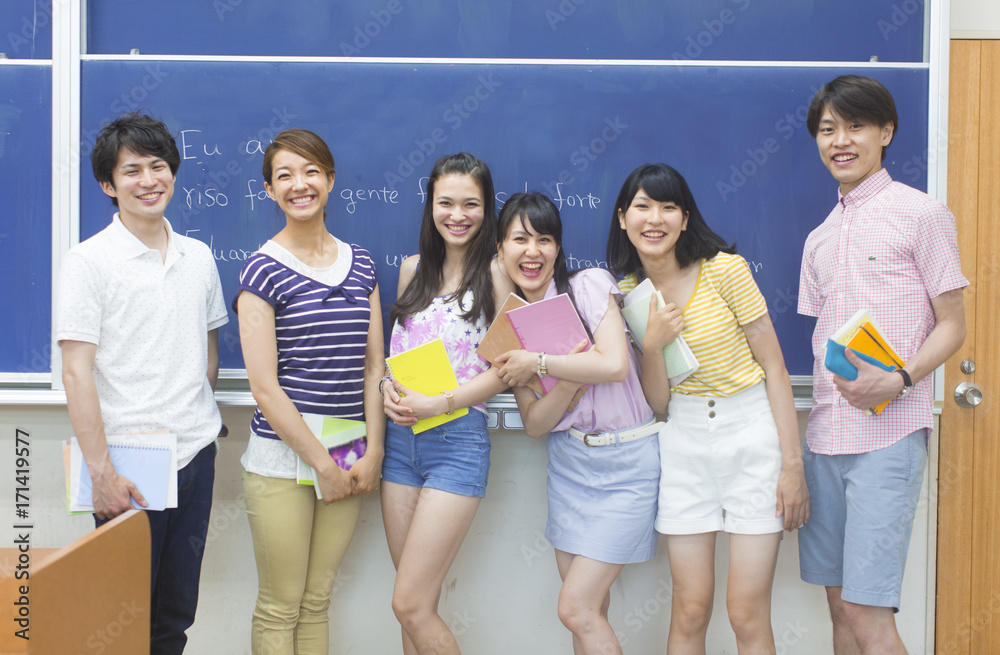 Six College Students Standing in front of Blackboard in Classroom Stock ...