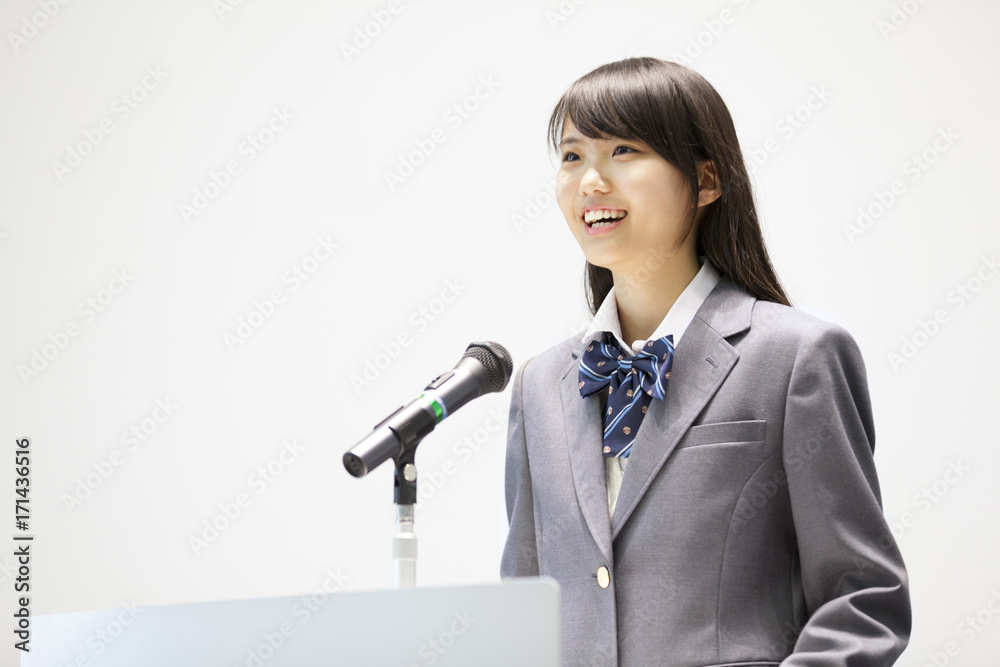 High school girl talking at podium Stock Photo | Adobe Stock