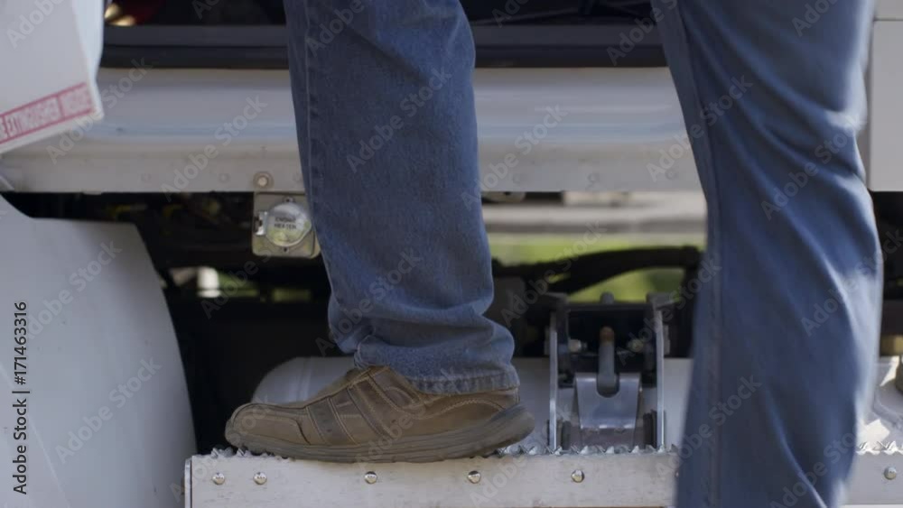 Vidéo Stock Detail of driver's feet climbing down from truck cab in ...