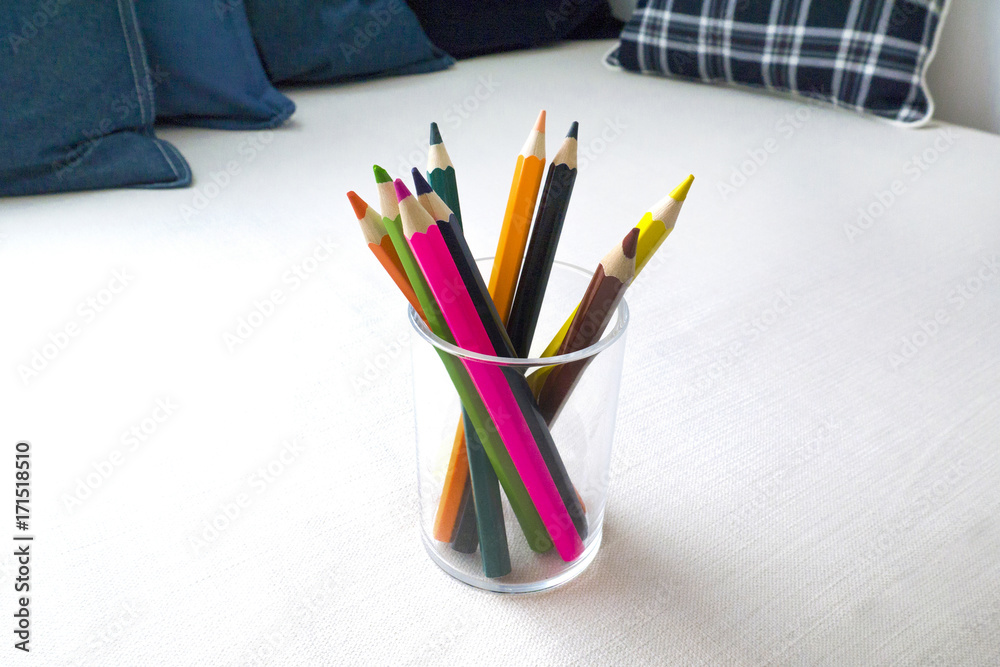 Colorful pencil in the glass on background. Stock Photo | Adobe Stock