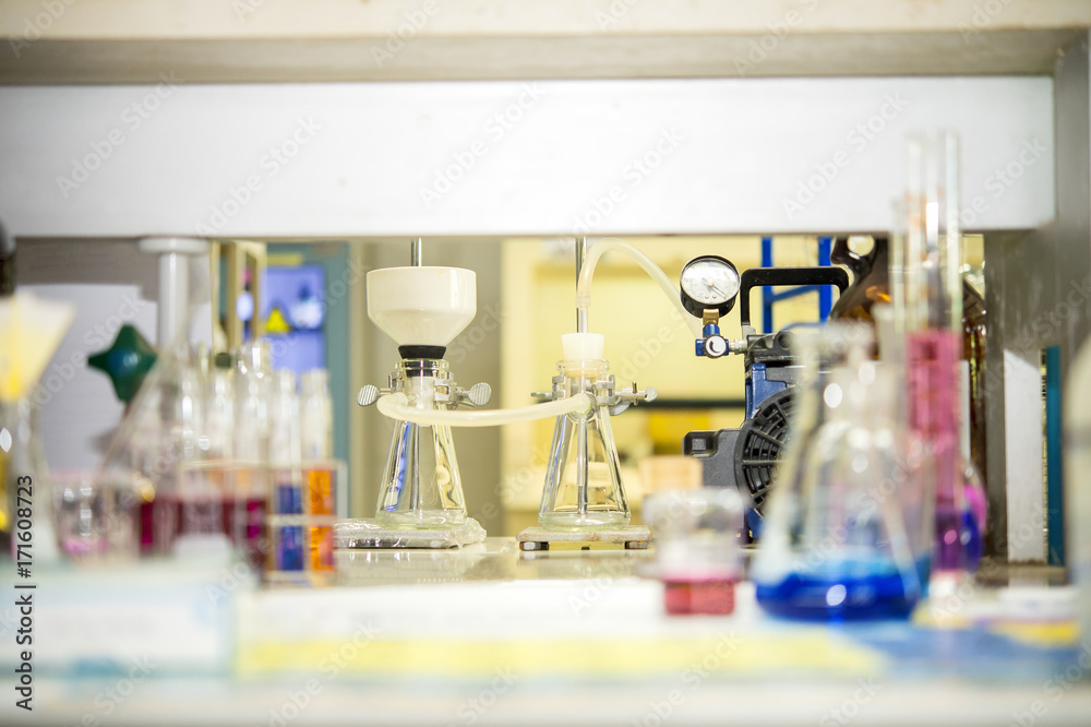 Chemical filtration with Buchner funnel bushings using a vacuum pump ...