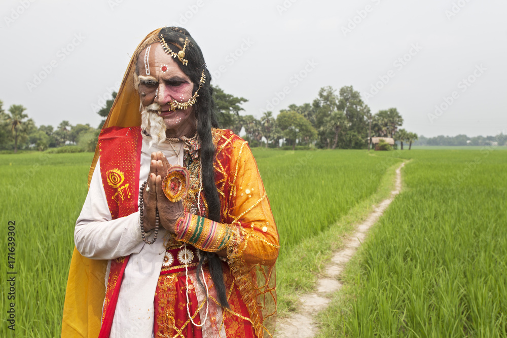 72 years old man decorating himself as ARDHYANARISWAR"(Half portion ...