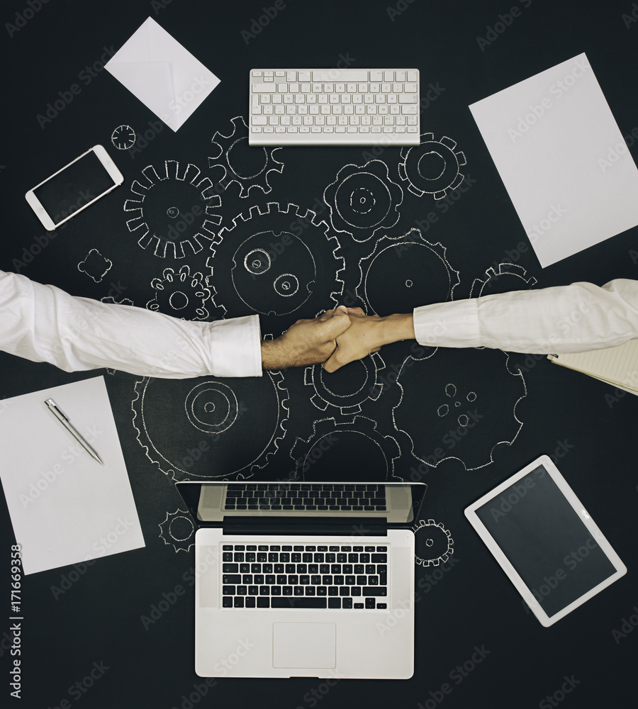 Handshaking and gears system Stock Photo | Adobe Stock