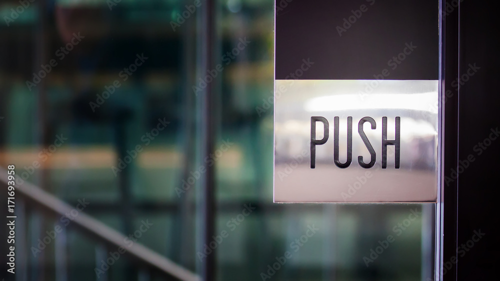 Push symbol at the door. Stock Photo | Adobe Stock
