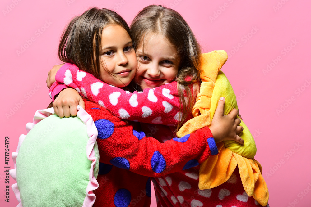 Girls with loose hair hug. Kids with smiling faces Stock Photo | Adobe ...