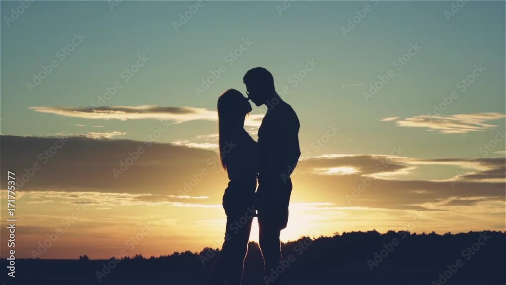 Couple in love at sunset Stock Video | Adobe Stock