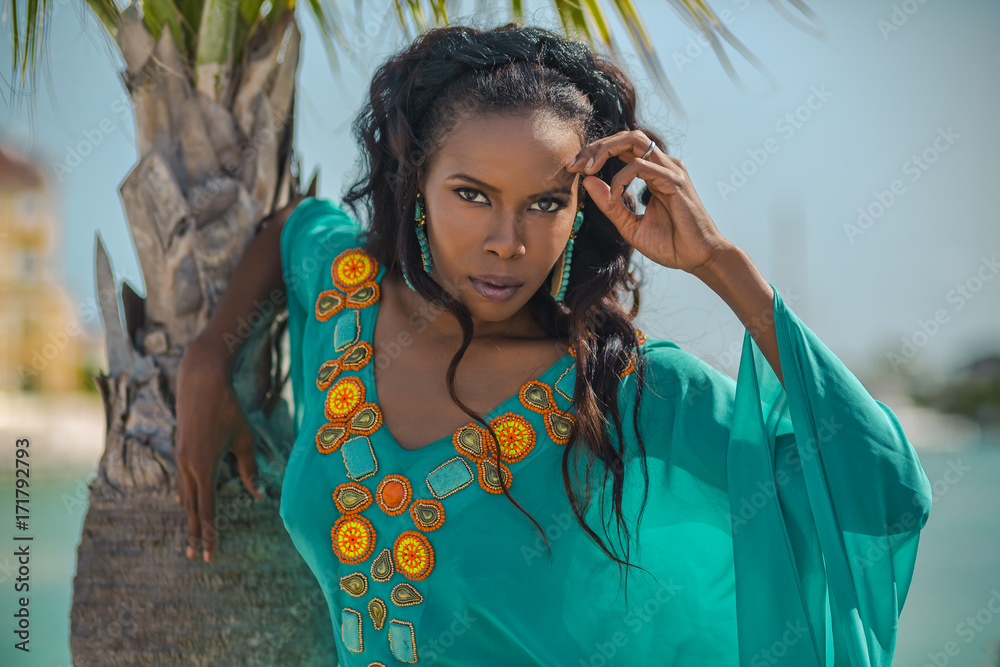 photo shoot of a beautiful dark-skinned latina on the background of ...