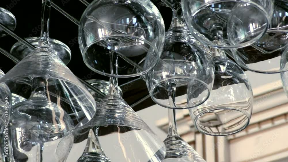 Glasses in the bar hanging on ceiling. Design alcohol pub counters. The ...