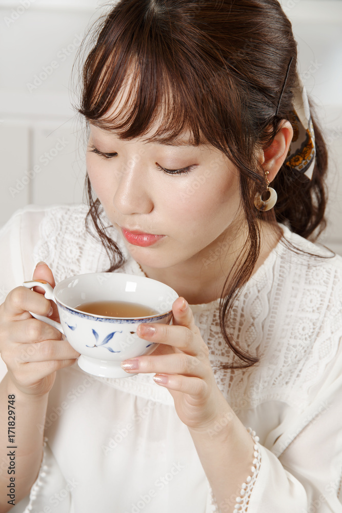 Beautiful Japanese woman enjoying tea Stock Photo | Adobe Stock