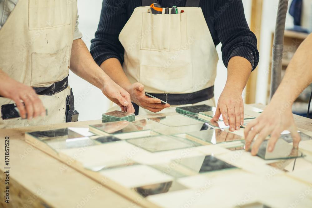 Carpenters workshop with a craftsman building a display case from wood ...