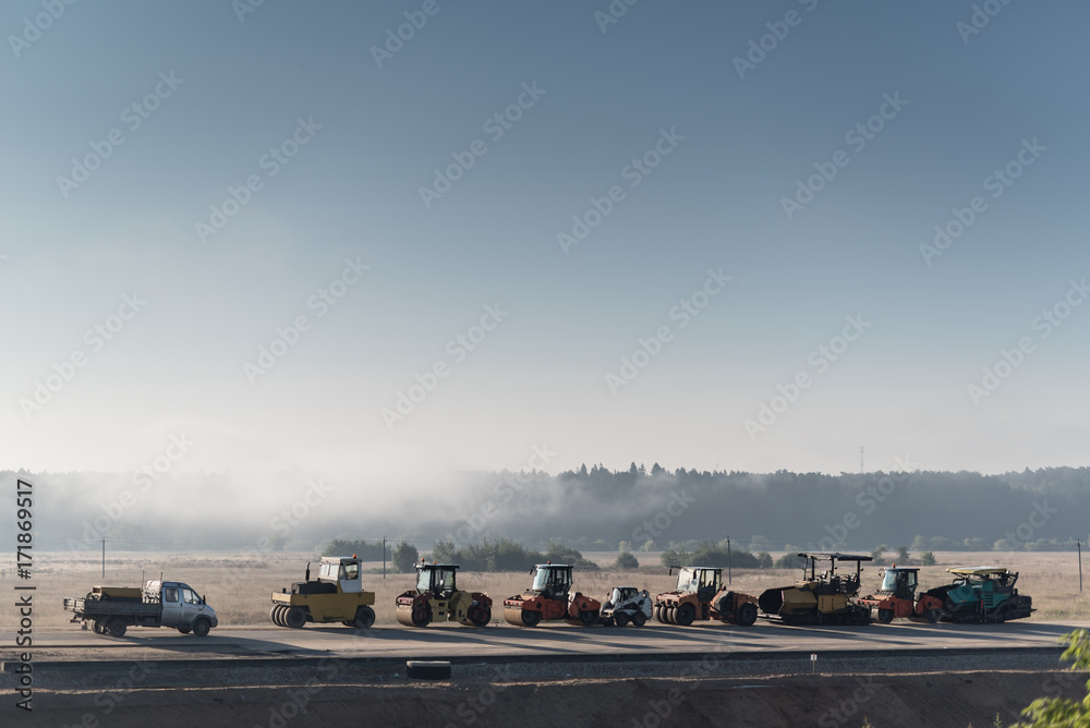 road under construction - wheel loader machine, pneumatic tyred roller ...