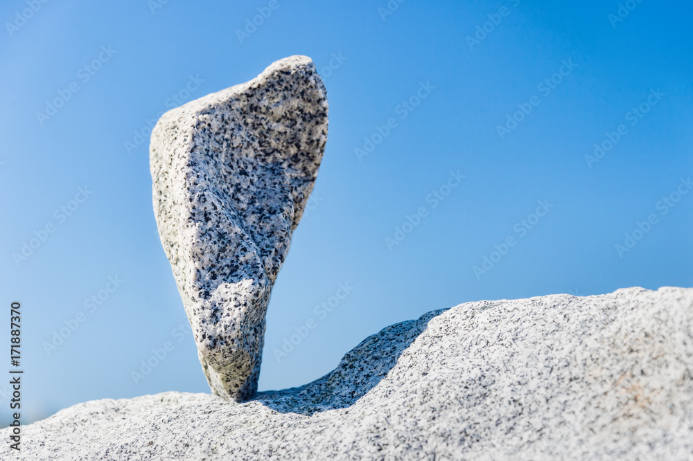 Triangular rock balanced on the tip in Vancouver rock stacking garden ...
