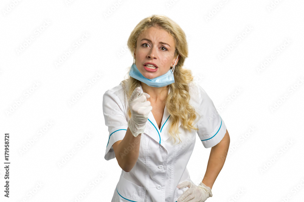 Portrait of angry female doctor or nurse. Annoyed young nurse or female ...