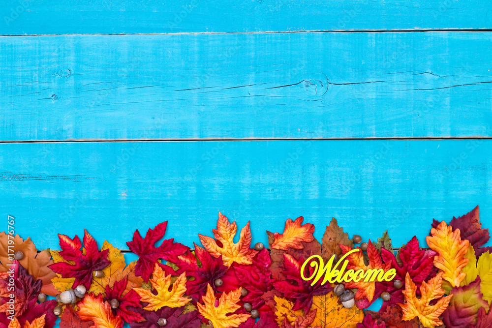 Welcome sign on rustic teal blue wood background with colorful autumn ...