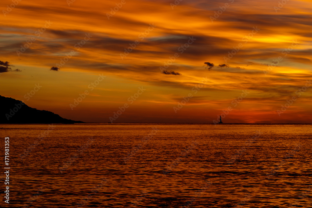Sunrise over the pinarello bay with a lost sailing ship. Stock Photo ...