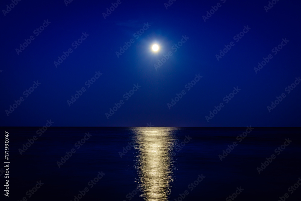 Full moon over the pinarello bay with cool reflection on the sea Stock ...