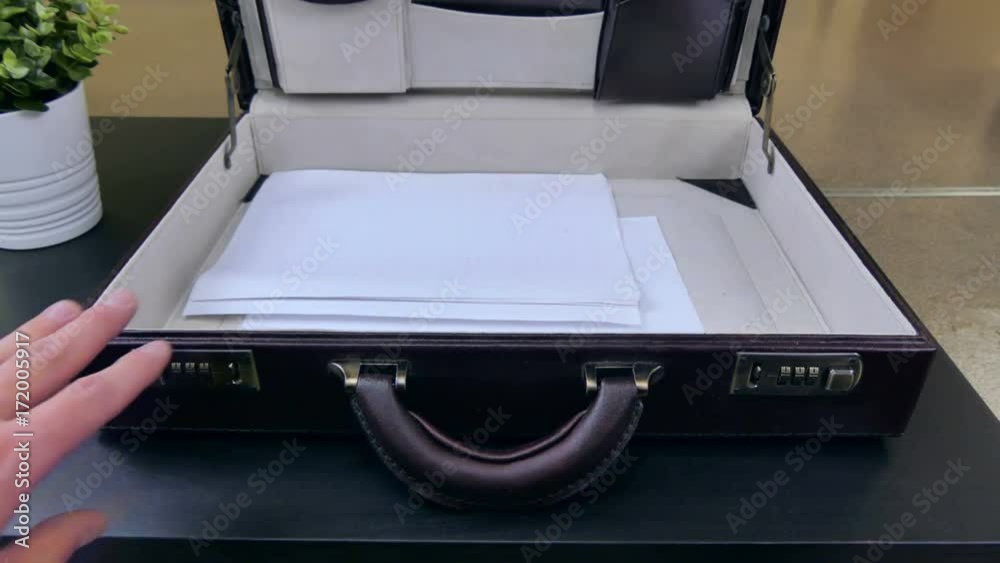 Opens the case with documents Stock Video | Adobe Stock