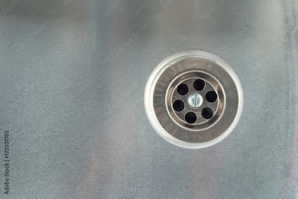 Water drain hole in stainless steel sink. Stock Photo | Adobe Stock