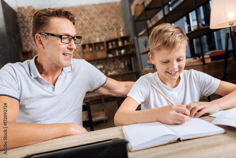 Pre-teen boy doing homework with father in the study Stock-Foto | Adobe ...