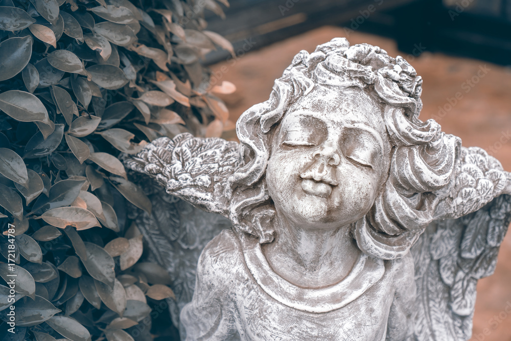 Little angels / View of sculpture of little angel in the garden. Stock ...