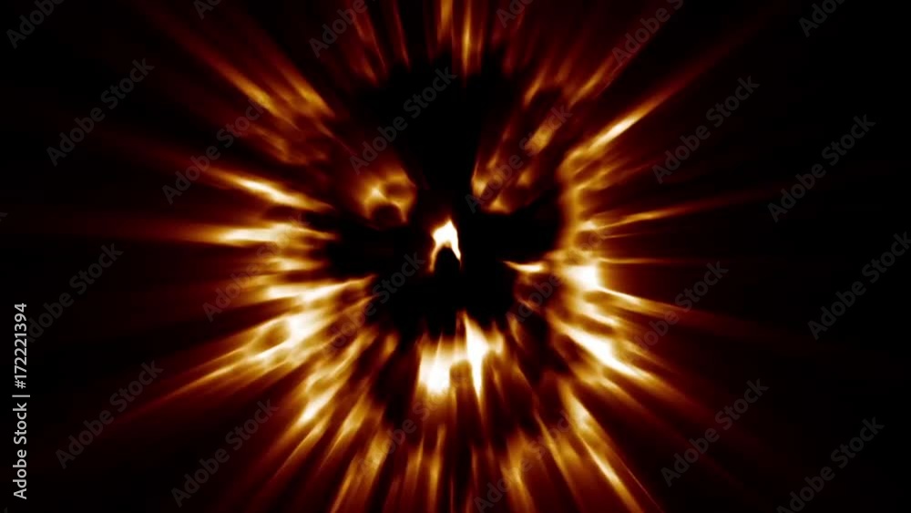 Skull shining with orange light and clattering with teeth. Dark ...