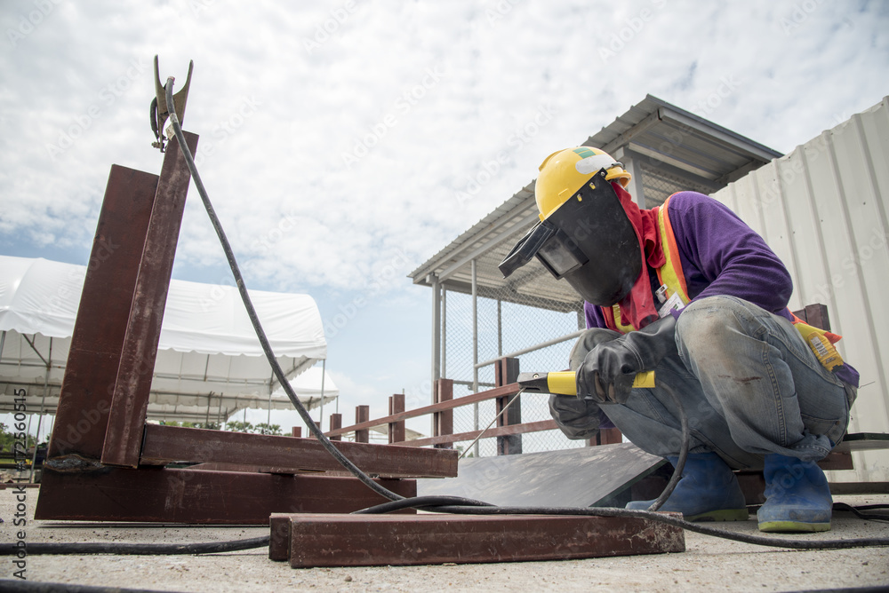 Industrial welder welding fabricated construction in factory Welding ...