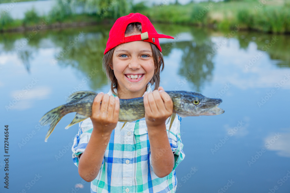 Cute boy enjoyed the fishing Stock Photo | Adobe Stock
