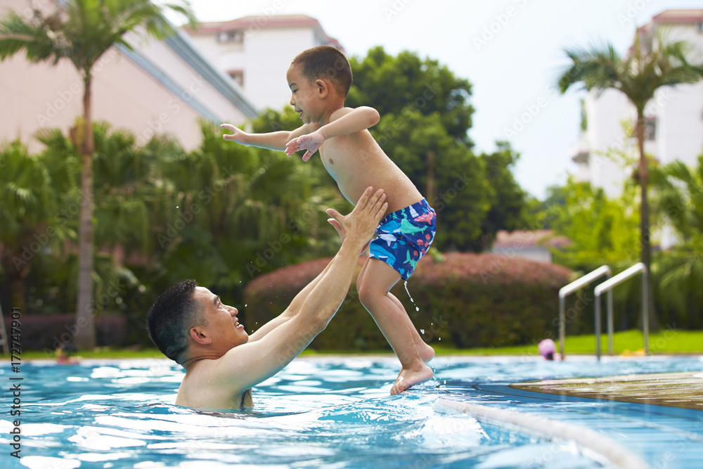 happy father with his son in the swimming pool Stock Photo | Adobe Stock