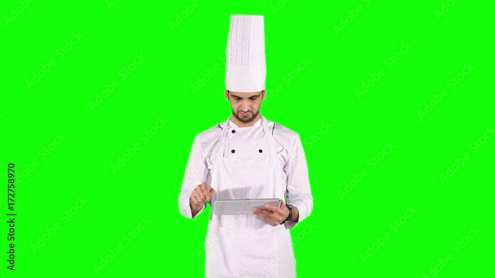 Vidéo Stock Male Caucasian chef using a digital tablet while standing ...
